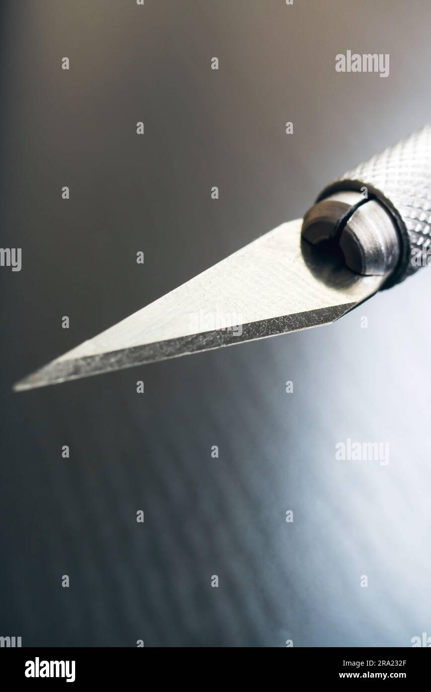 Sharp blade of a metal scalpel close up Stock Photo - Alamy