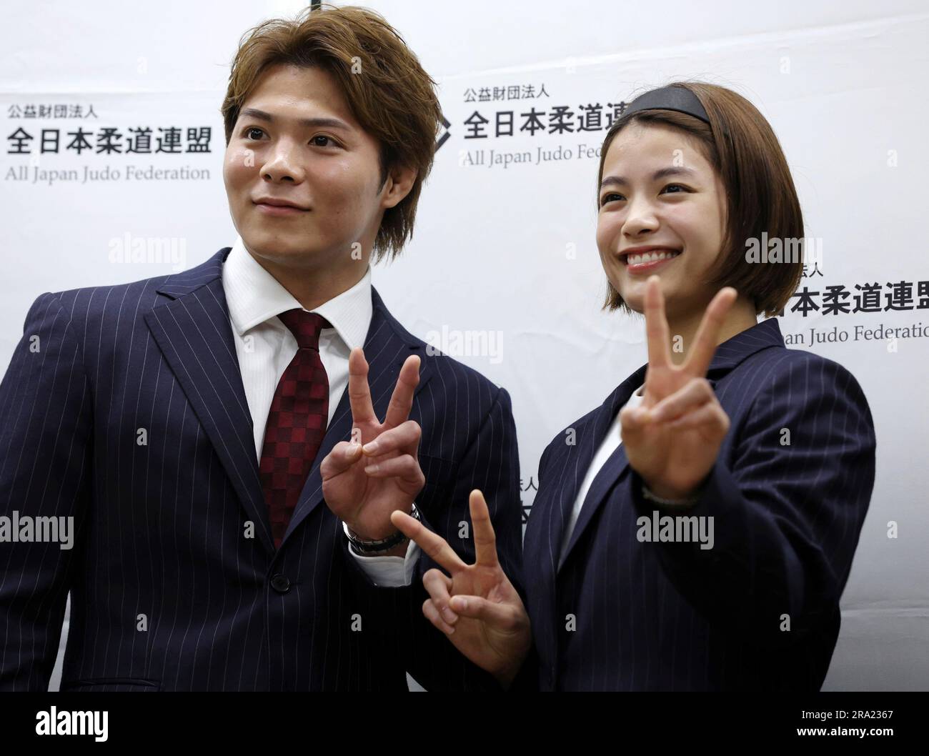 Olympic champion siblings Hifumi Abe (L) and Uta pose during a photo ...