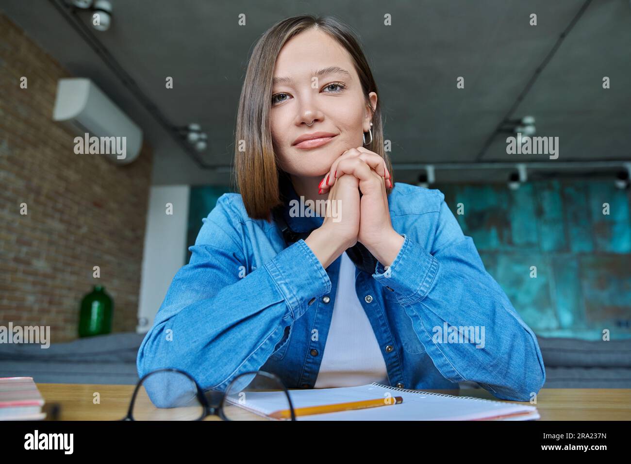 Close-up webcam view of face female university student Stock Photo - Alamy