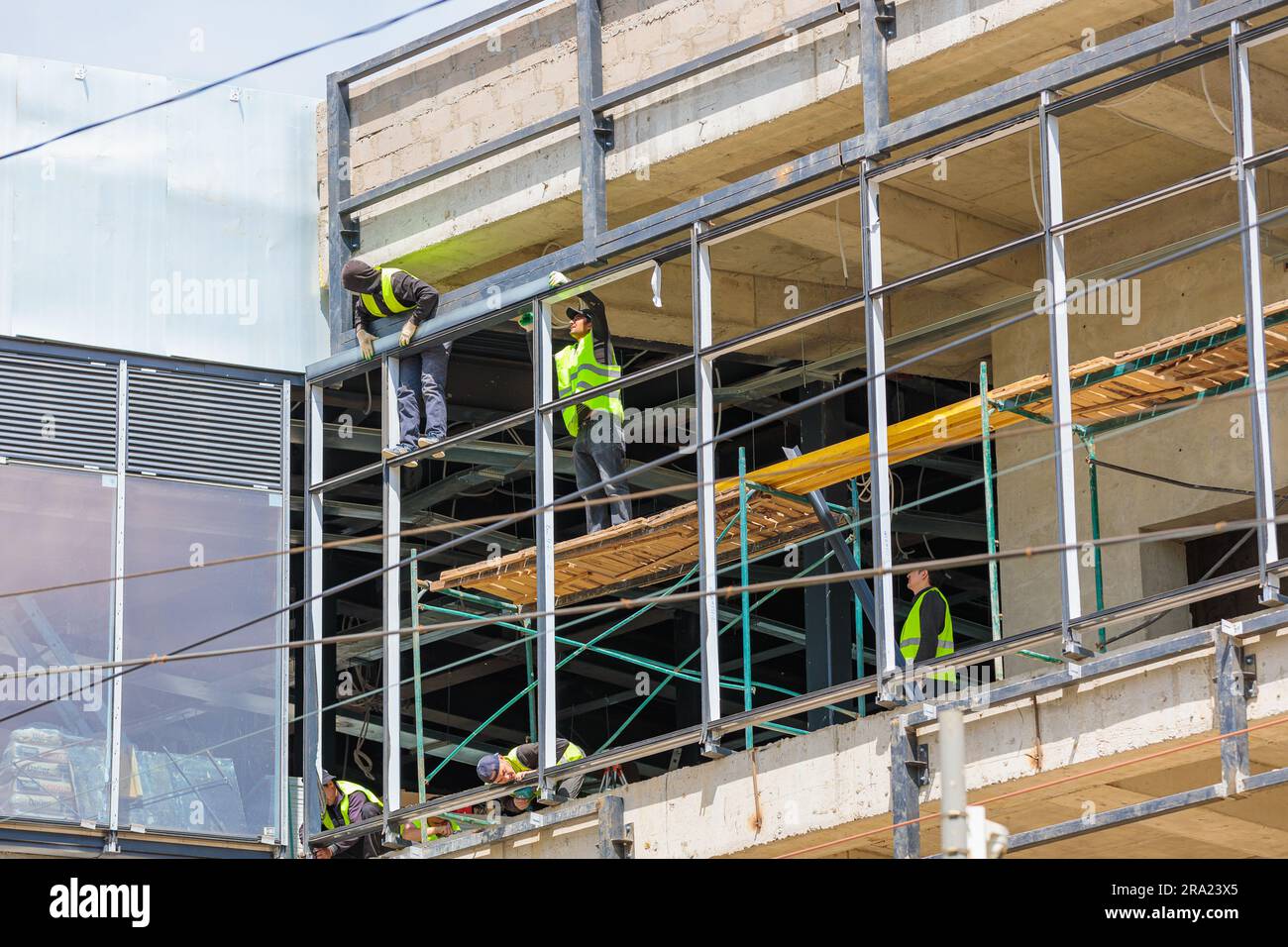 Moscow, Russia. June 30, 2023. Male construction workers are installing ...