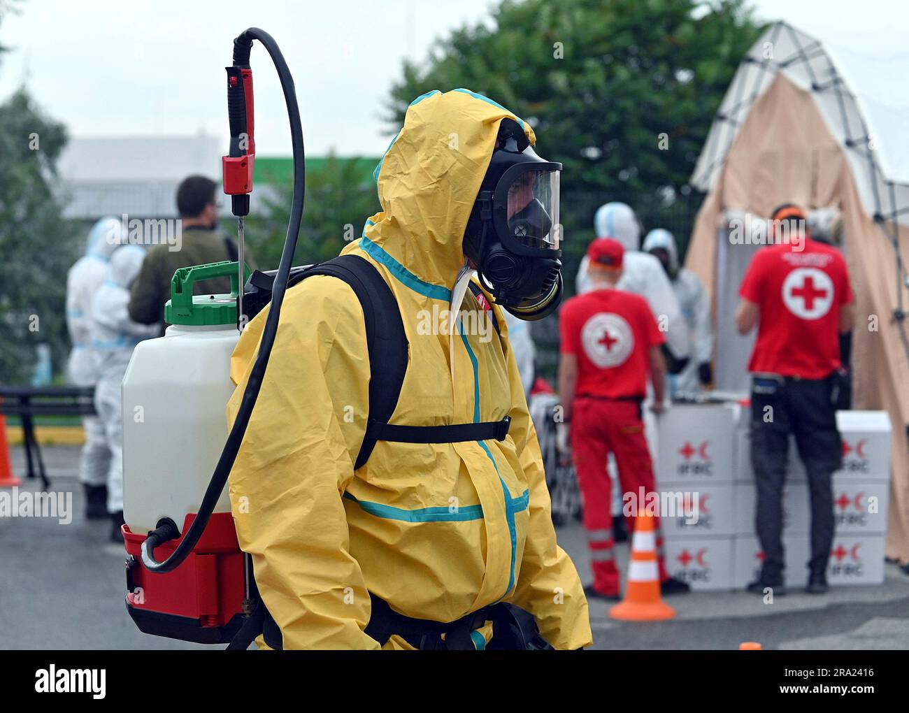 ZAPORIZHZHIA, UKRAINE - JUNE 29, 2023 - A worker in a hazmat suit and ...