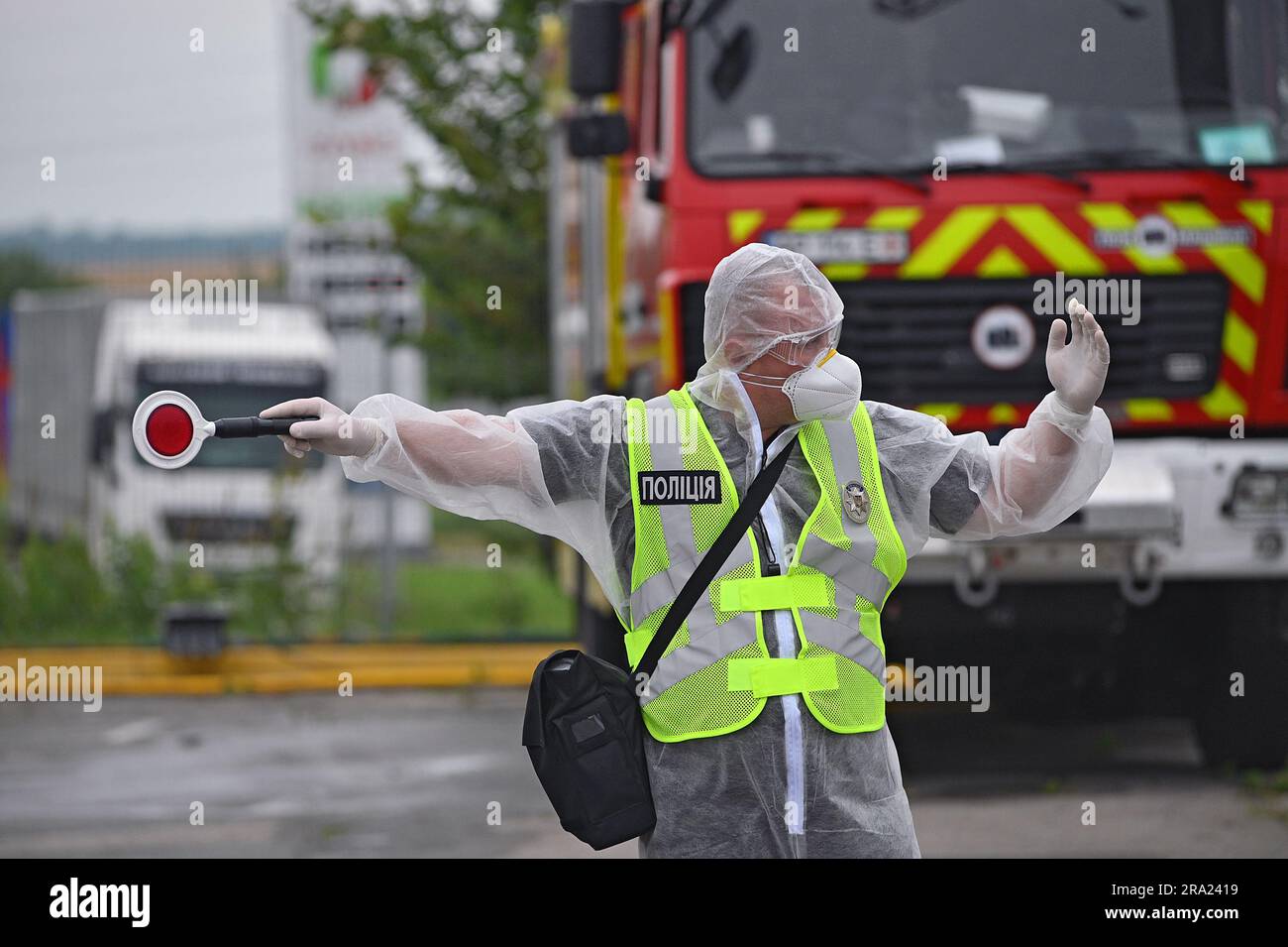 ZAPORIZHZHIA, UKRAINE - JUNE 29, 2023 - A police officer signals during ...
