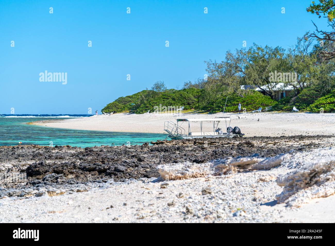 Glass-bottomed boat anchored in protected waters of Lagoon Beach, Lady ...