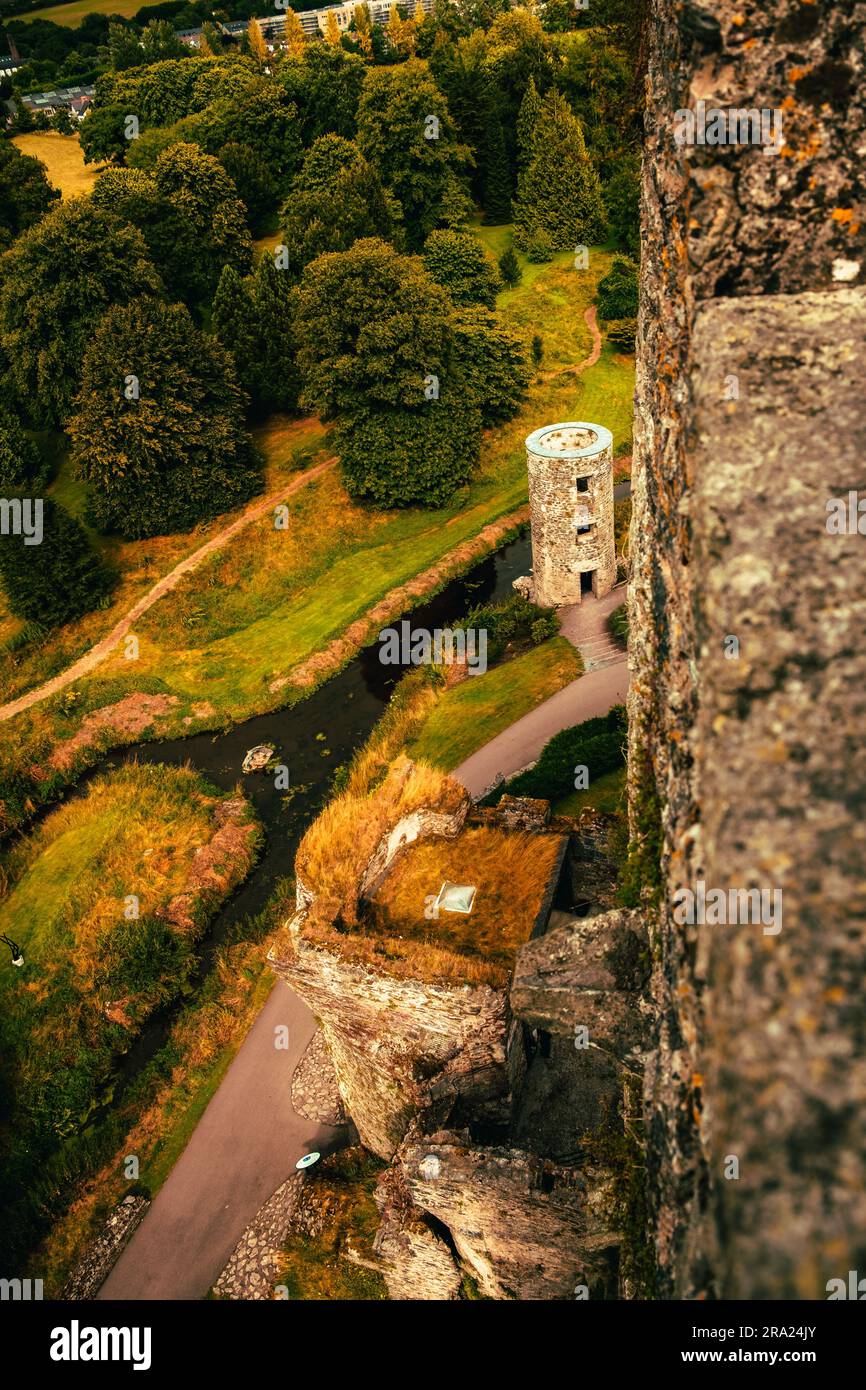A stunning view of the iconic Blarney Castle set against a lush, green ...