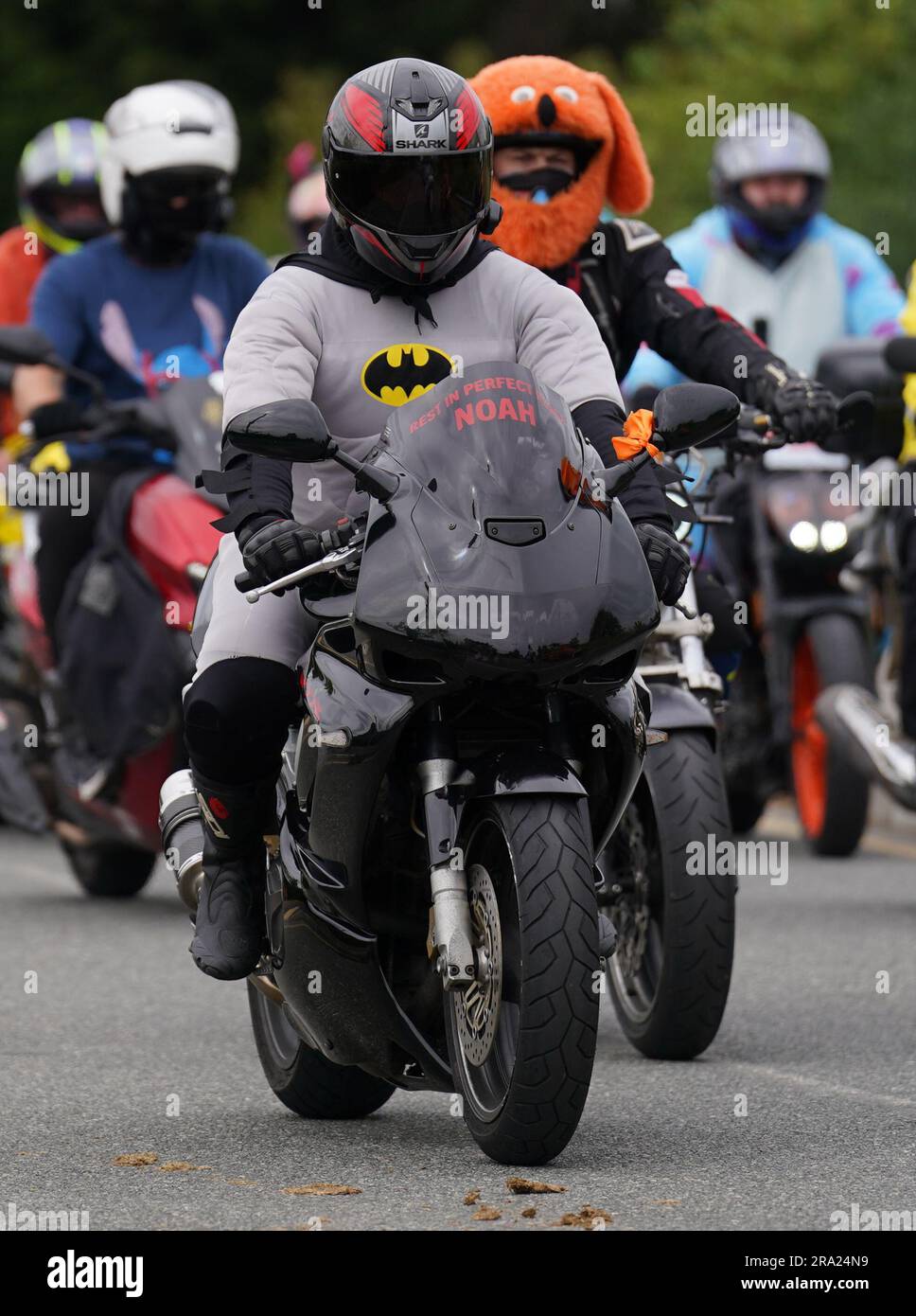 Bikers dressed in Disney costumes ride motorbikes in the Disney-themed ...