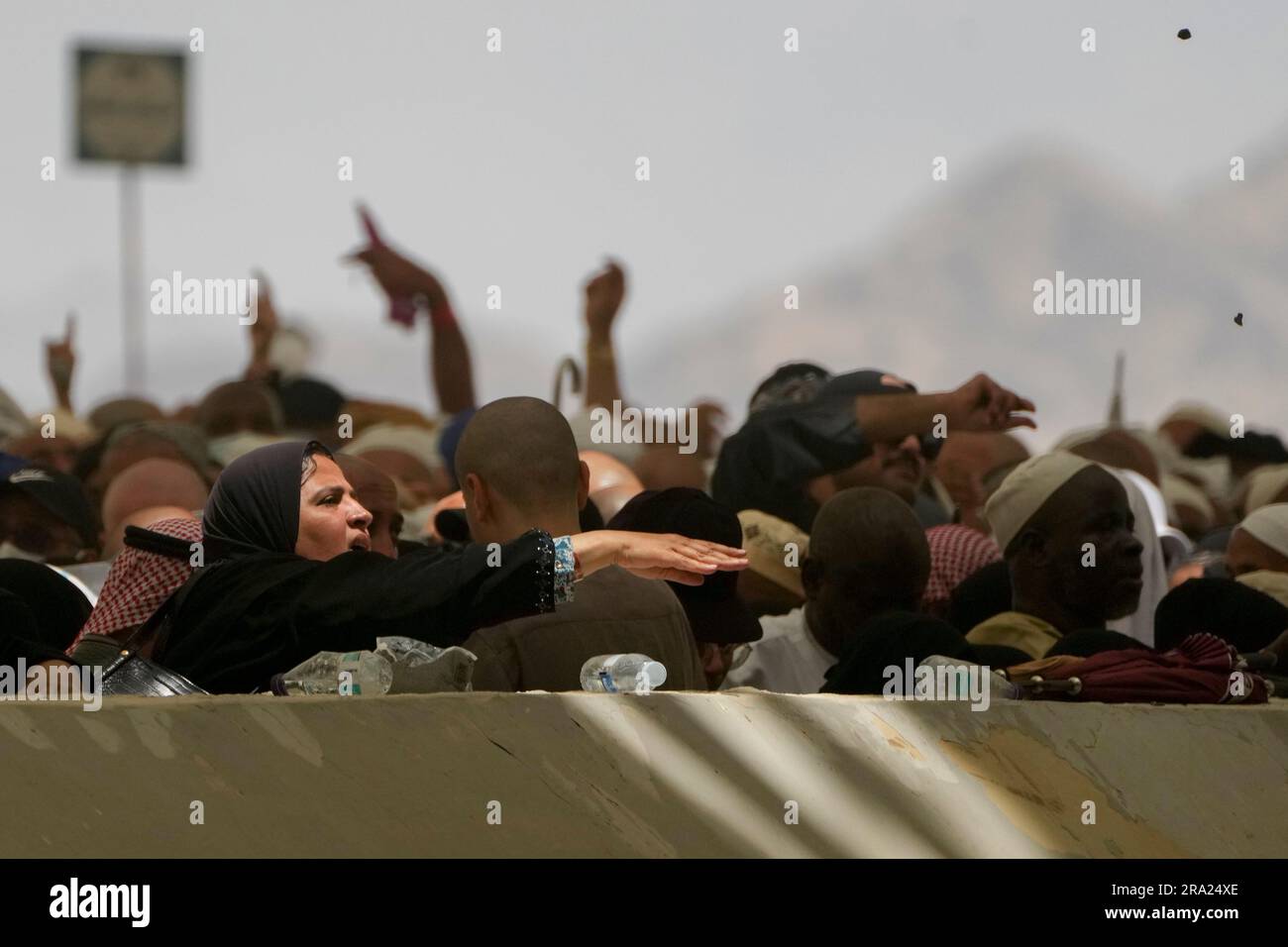 Muslim pilgrims cast stones at pillars in the symbolic stoning of the ...