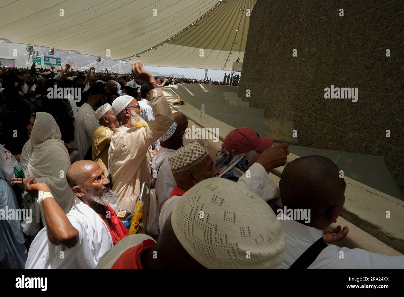 Muslim pilgrims cast stones at pillars in the symbolic stoning of the ...