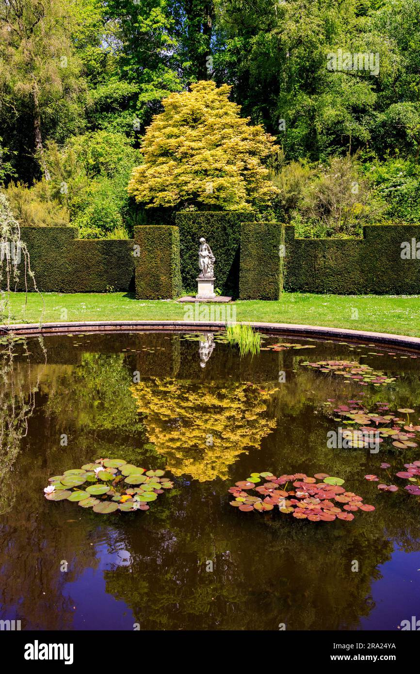 Reflections of the statue in the still waters of the circular Pool ...