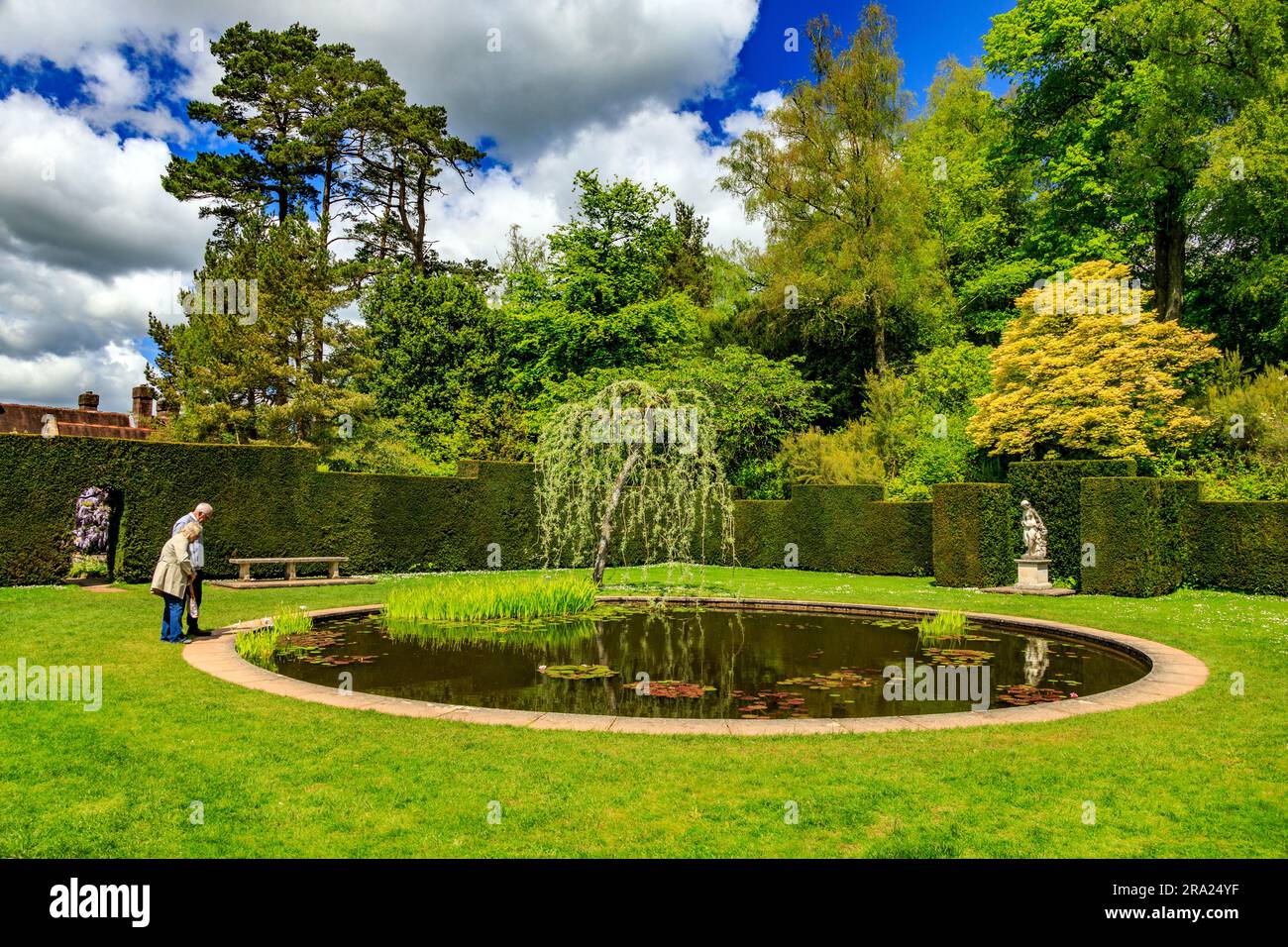 Two visitors enjoying the peaceful tranquillity of the still waters in ...