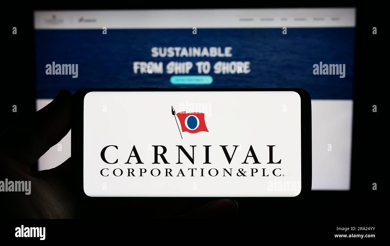 Person holding smartphone with logo of cruise company Carnival ...