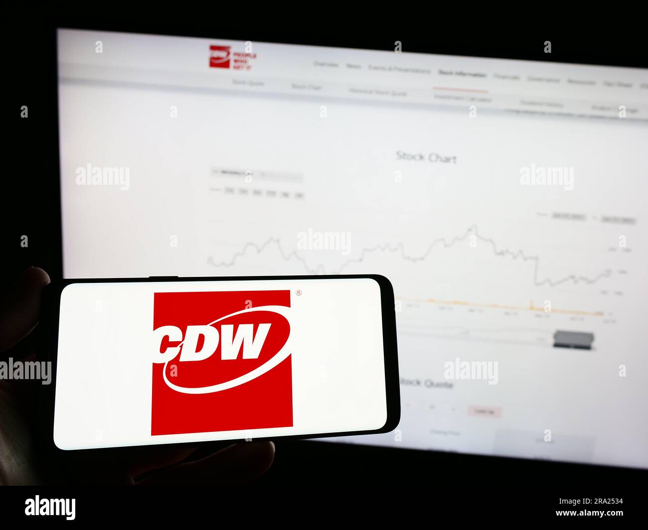 Person holding mobile phone with logo of American technology company ...