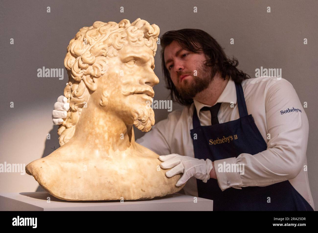London, UK. 30 June 2023. A technicians presents “Colossal Bust of an ...