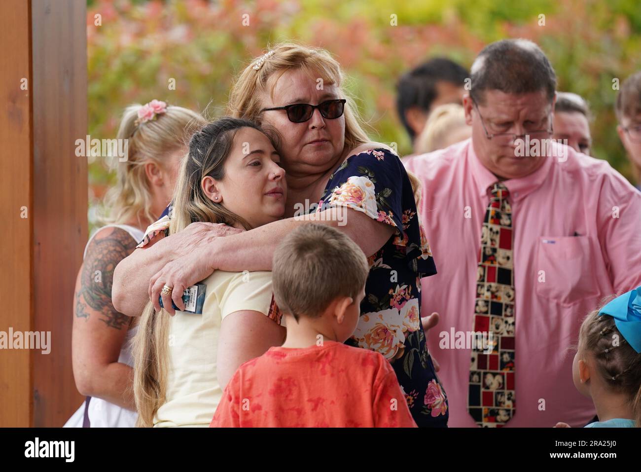 Channell Cox-Lee (left) the mother of Noah Cox-Lee, is comforted ...