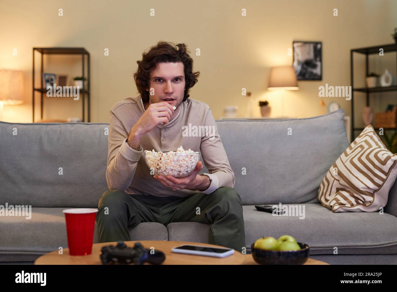 Man sitting in front of his tv set hi-res stock photography and images ...