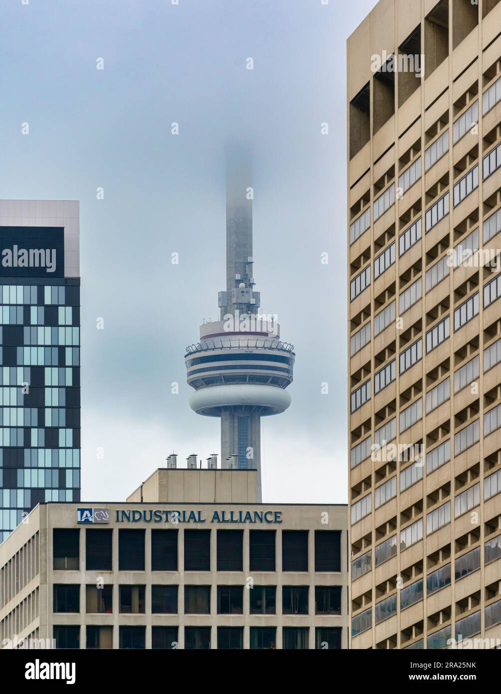CN Tower framed in buildings in a foggy day Stock Photo - Alamy