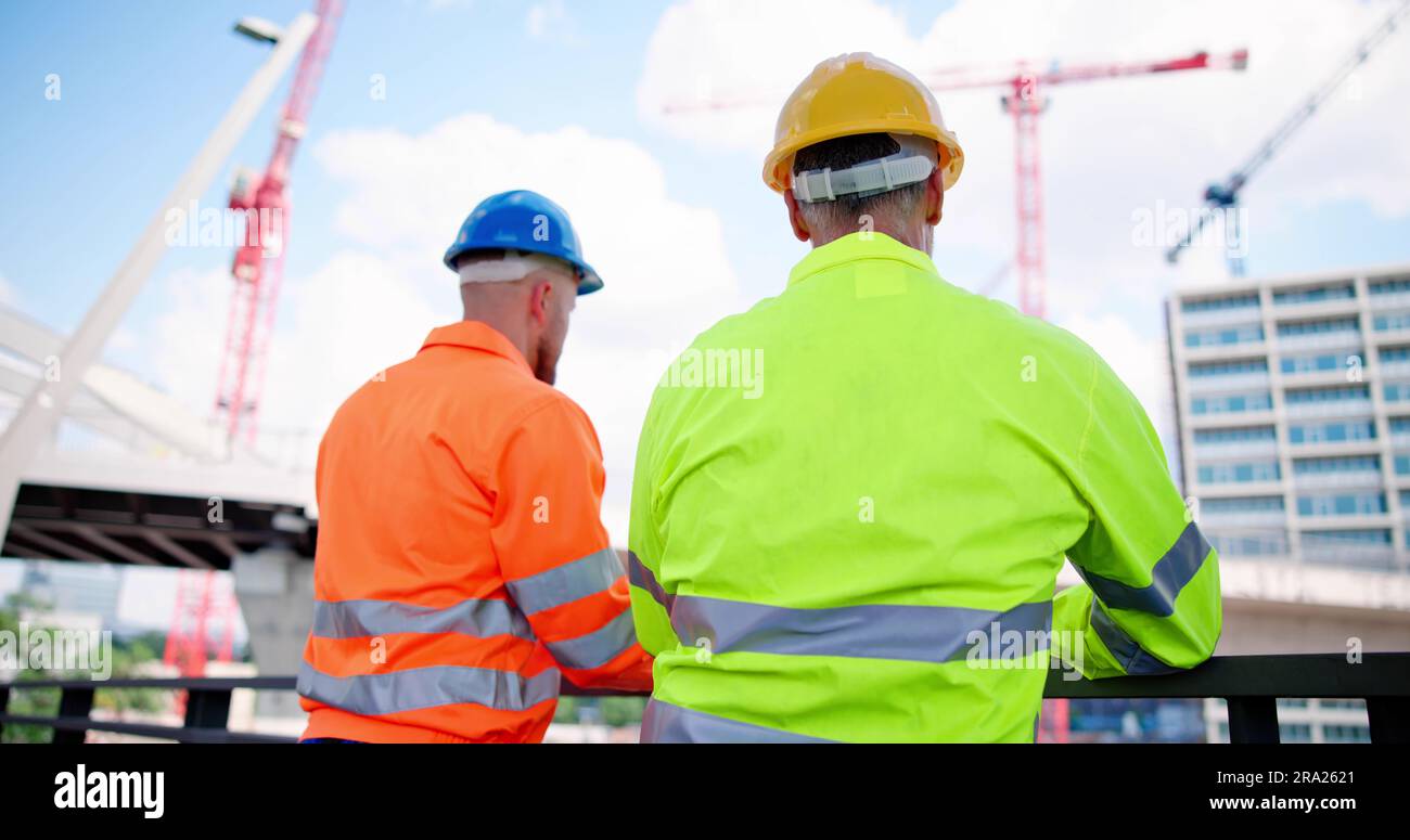 OSHA Inspector At Construction Site. Engineer Workers Stock Photo - Alamy