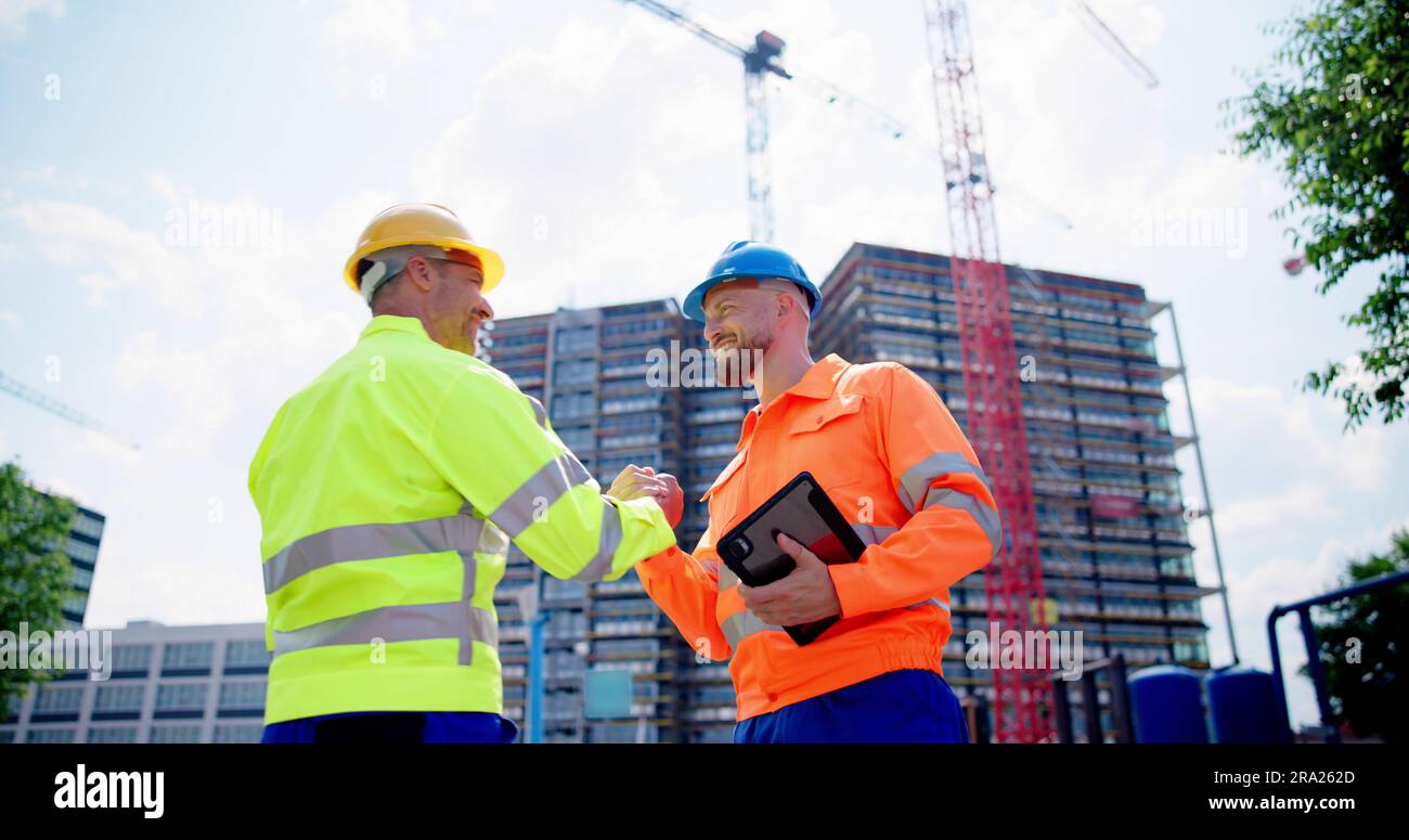 Construction Site Worker Hand Shake. Engineer Handshake Stock Photo - Alamy