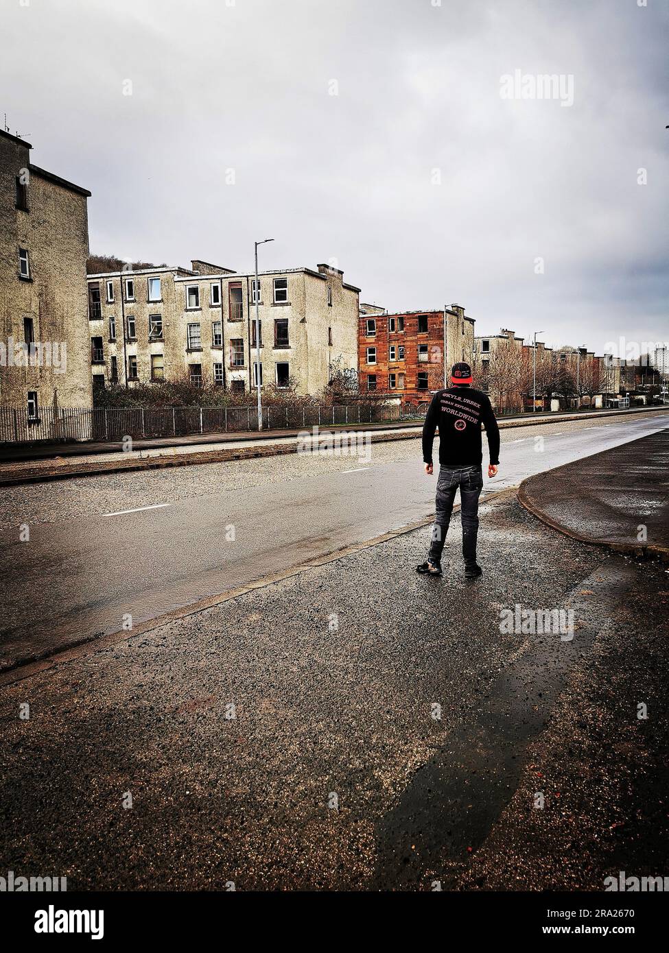 Urban explorer Kyle poses for a picture in front of the derelict ...