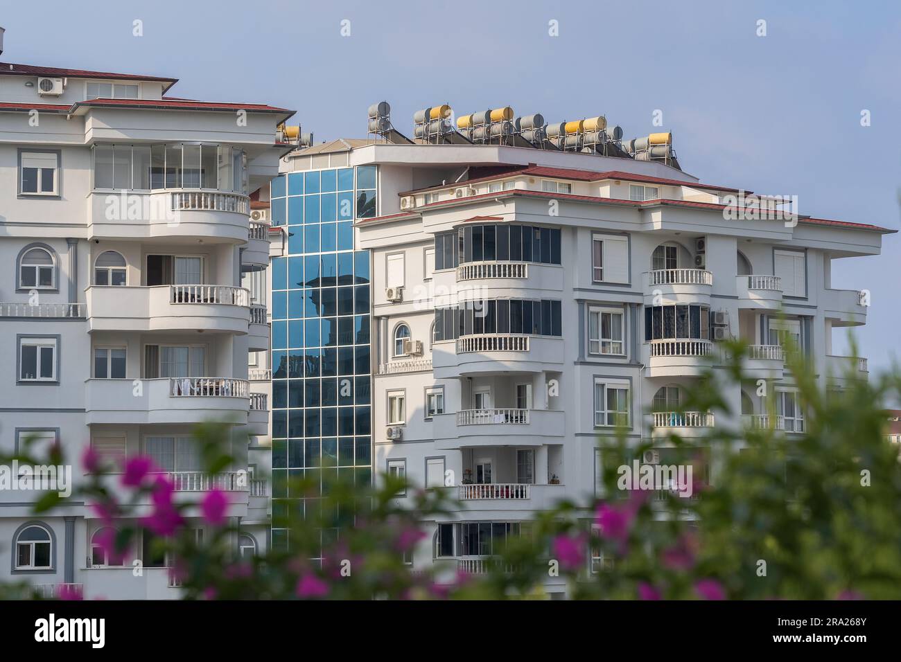 Residential apartment buildings illuminated by the rays of the rising ...
