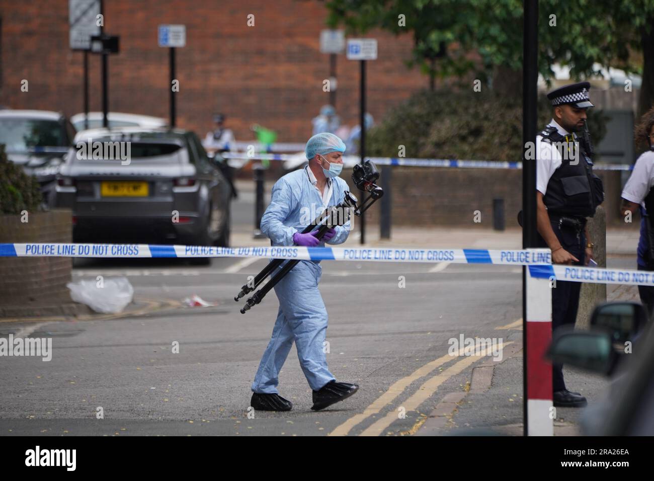 Forensic officers in Elthorne Road, Islington, London after a man and a ...