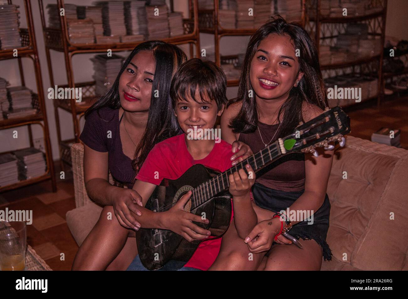Portrait of a 9 year old mixed race boy (Cambodian - American) playing ...