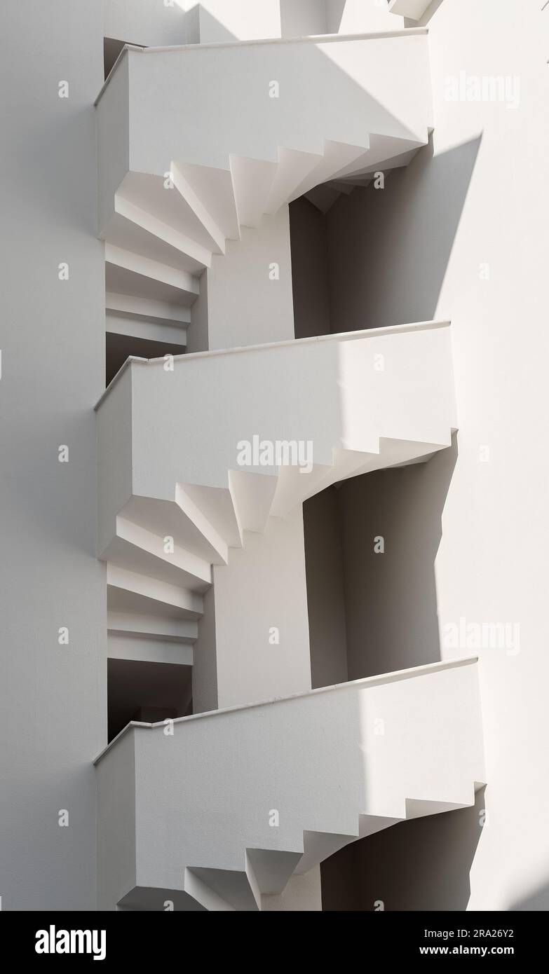 Spiral concrete staircase outside the building. architectural detail ...