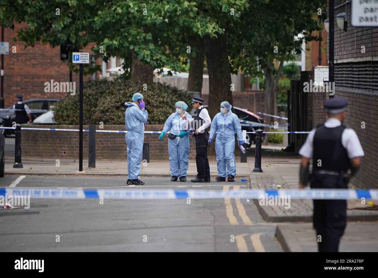Forensic officers in Elthorne Road, Islington, London after a man and a ...