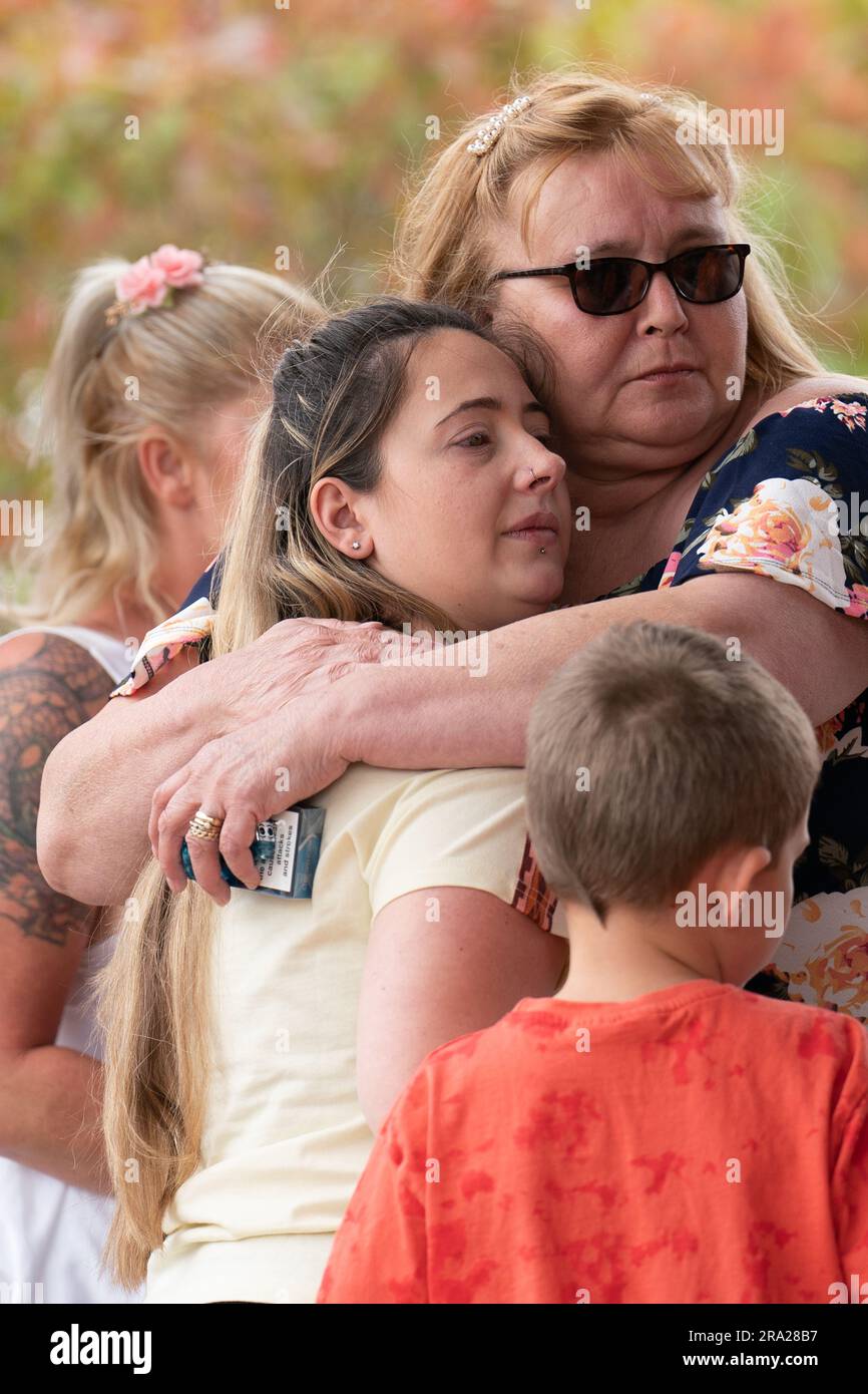 Channell Cox-Lee (left) the mother of Noah Cox-Lee, is comforted ...