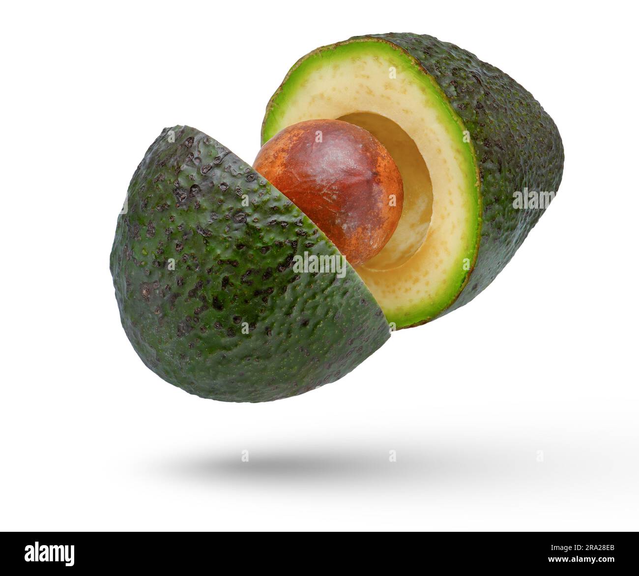 Flying avocado divided into parts isolated on a white background ...