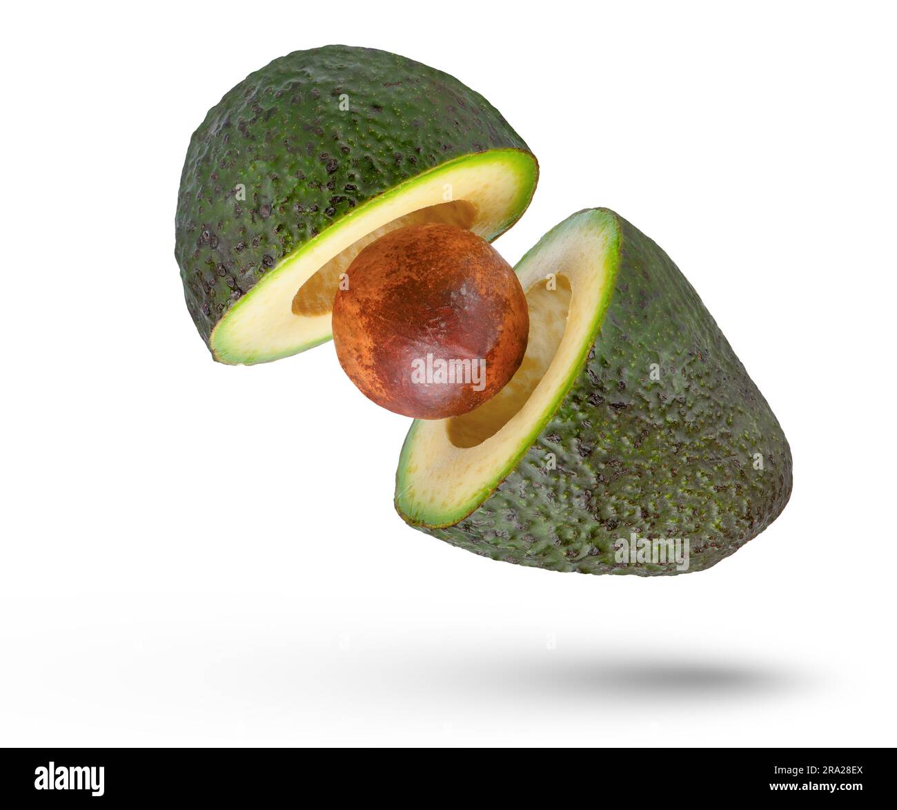 Ripe juicy avocado divided into pieces isolated on white background ...