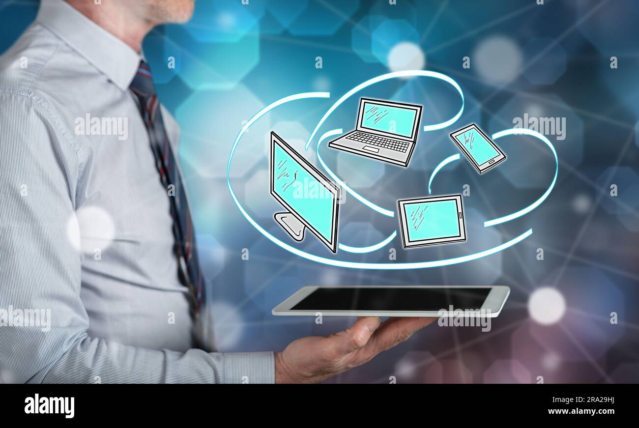 Devices connection concept above a tablet held by a man Stock Photo - Alamy