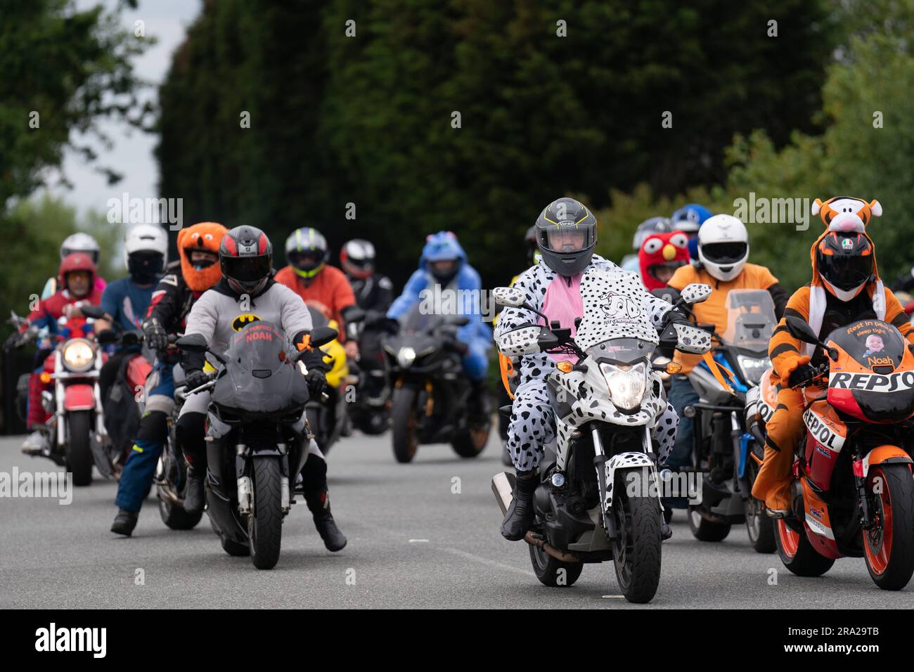 Bikers dressed in Disney costumes ride motorbikes in the Disney-themed ...