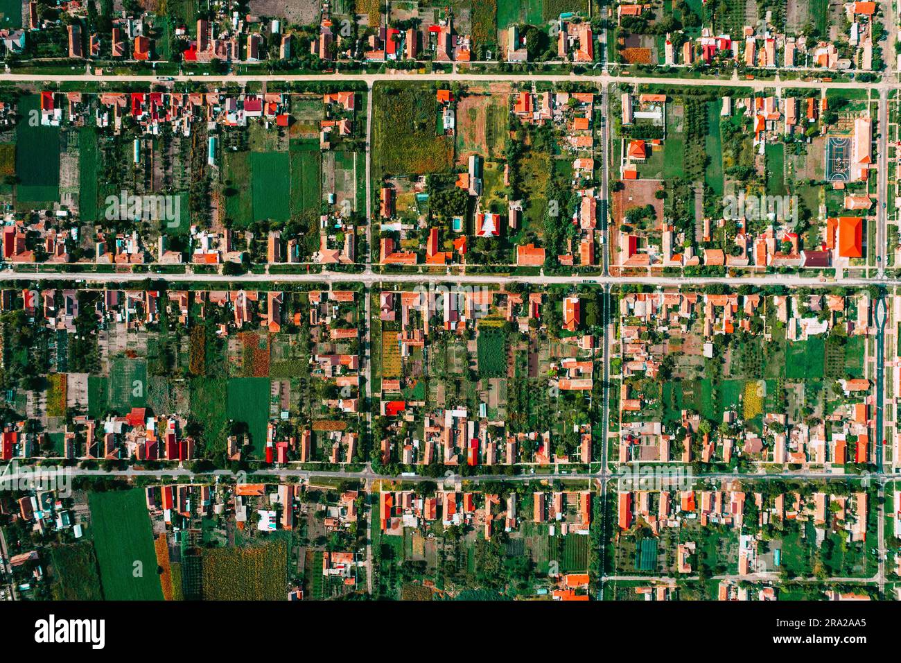 An aerial view of a residential area with numerous houses surrounded by ...