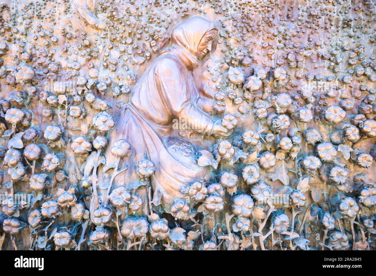 Woman picking cotton. Detail of the front entrance bronze frieze. At ...