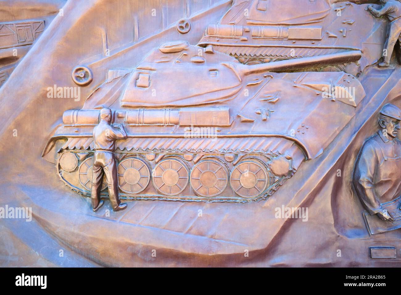 Factory worker building a tank. Detail of the front entrance bronze frieze. At the Shon Sharaf ...