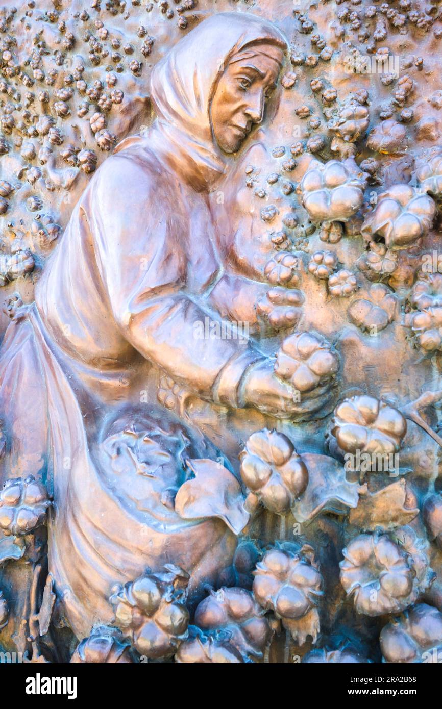 Woman picking cotton. Detail of the front entrance bronze frieze. At ...