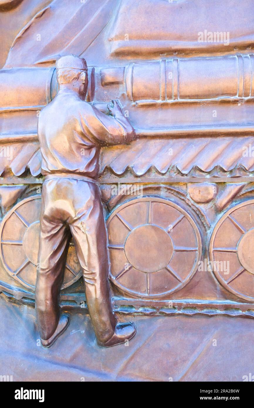 Factory worker building a tank. Detail of the front entrance bronze frieze. At the Shon Sharaf ...