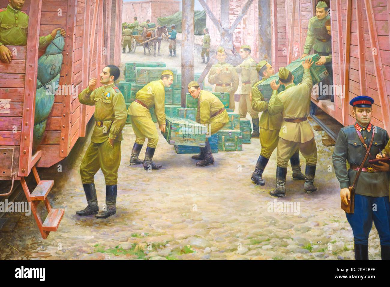 Soldiers load wood cases onto trains. Part of the large mural of the ...