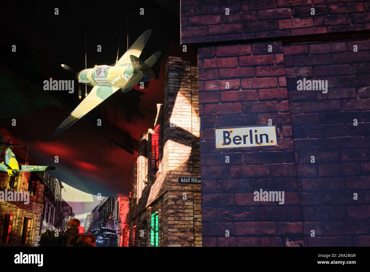 Part of a large diorama with fighter airplane and Berlin sign. At the ...