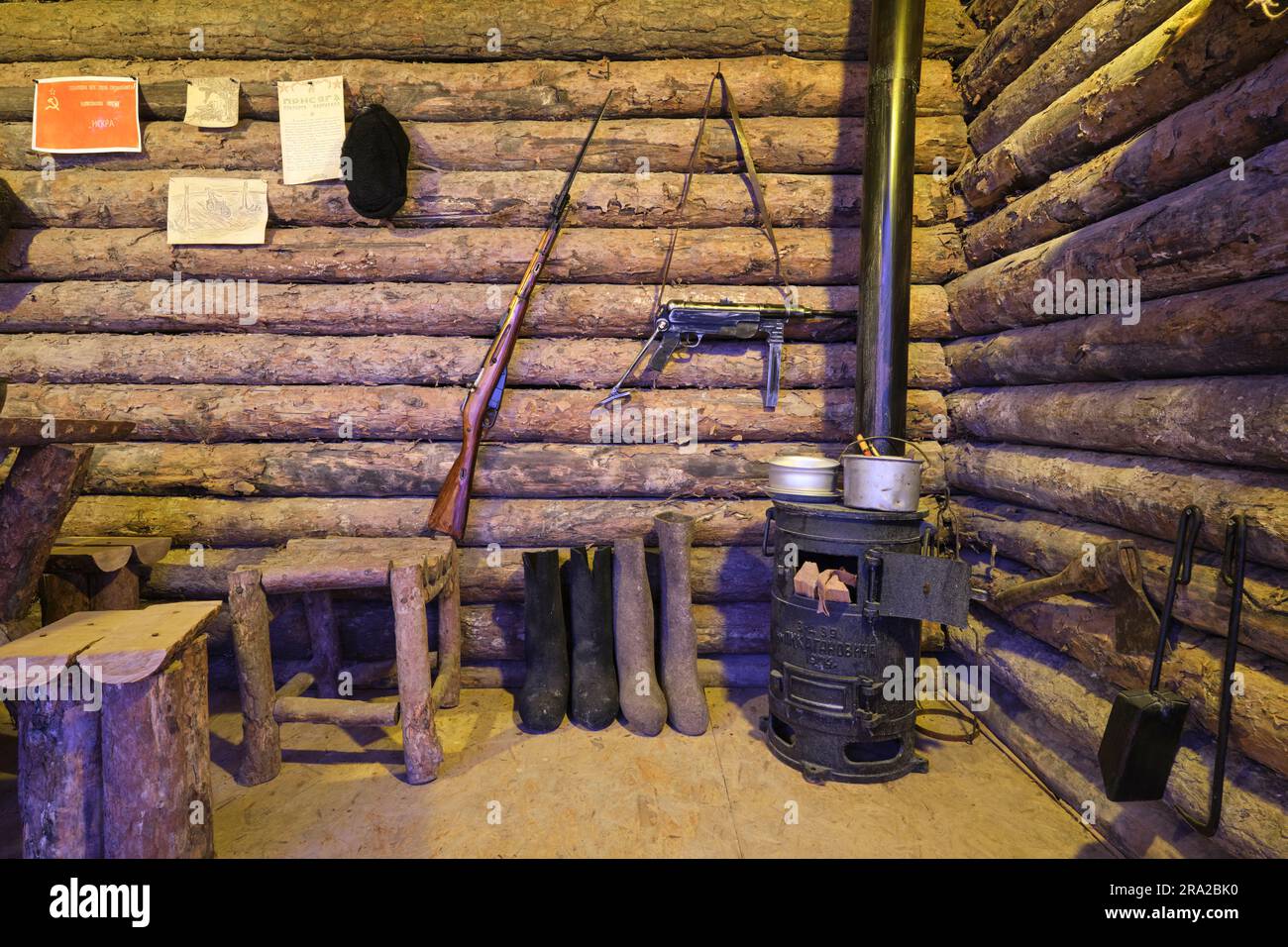 Detail in a diorama of a log shelter, bunker with wood burning stove ...