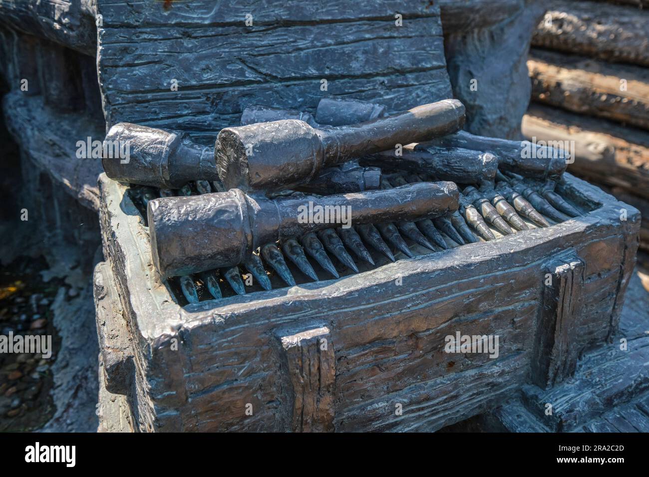 A sculpture of a Red Army ammunition case with bullets and hand ...
