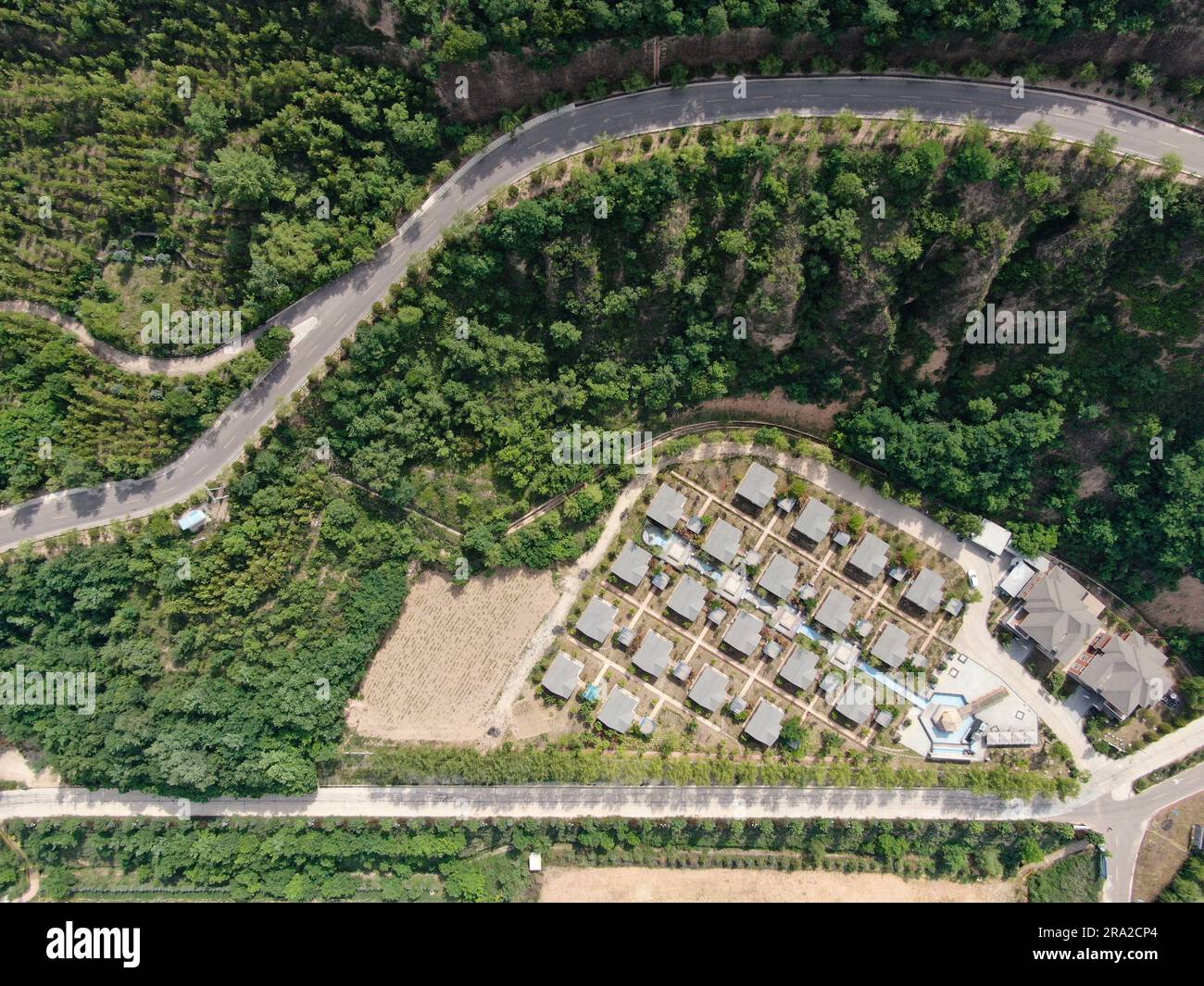 Yan'an. 27th June, 2023. This aerial photo taken on June 27, 2023 shows ...