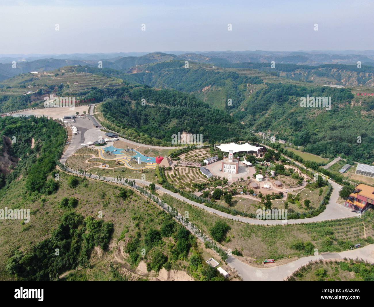 Yan'an. 27th June, 2023. This aerial photo taken on June 27, 2023 shows ...