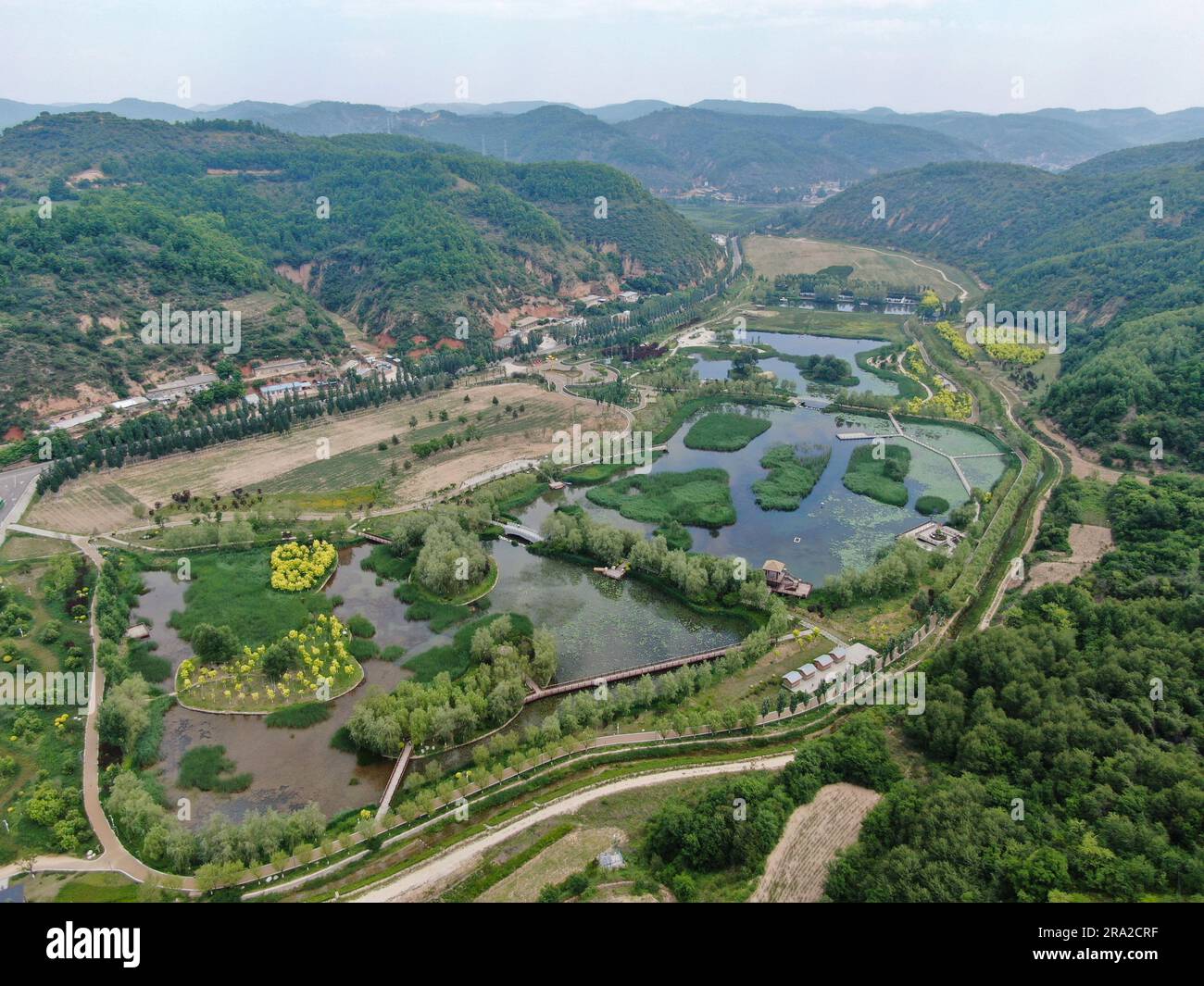 Yan'an. 26th June, 2023. This aerial photo taken on June 26, 2023 shows ...