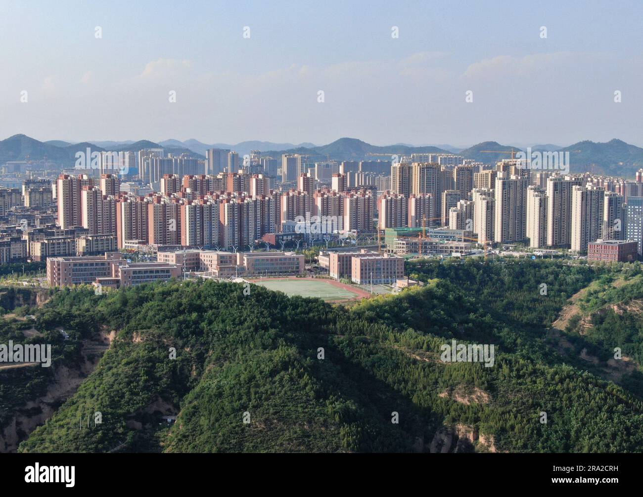 Yan'an. 26th June, 2023. This aerial photo taken on June 26, 2023 shows ...