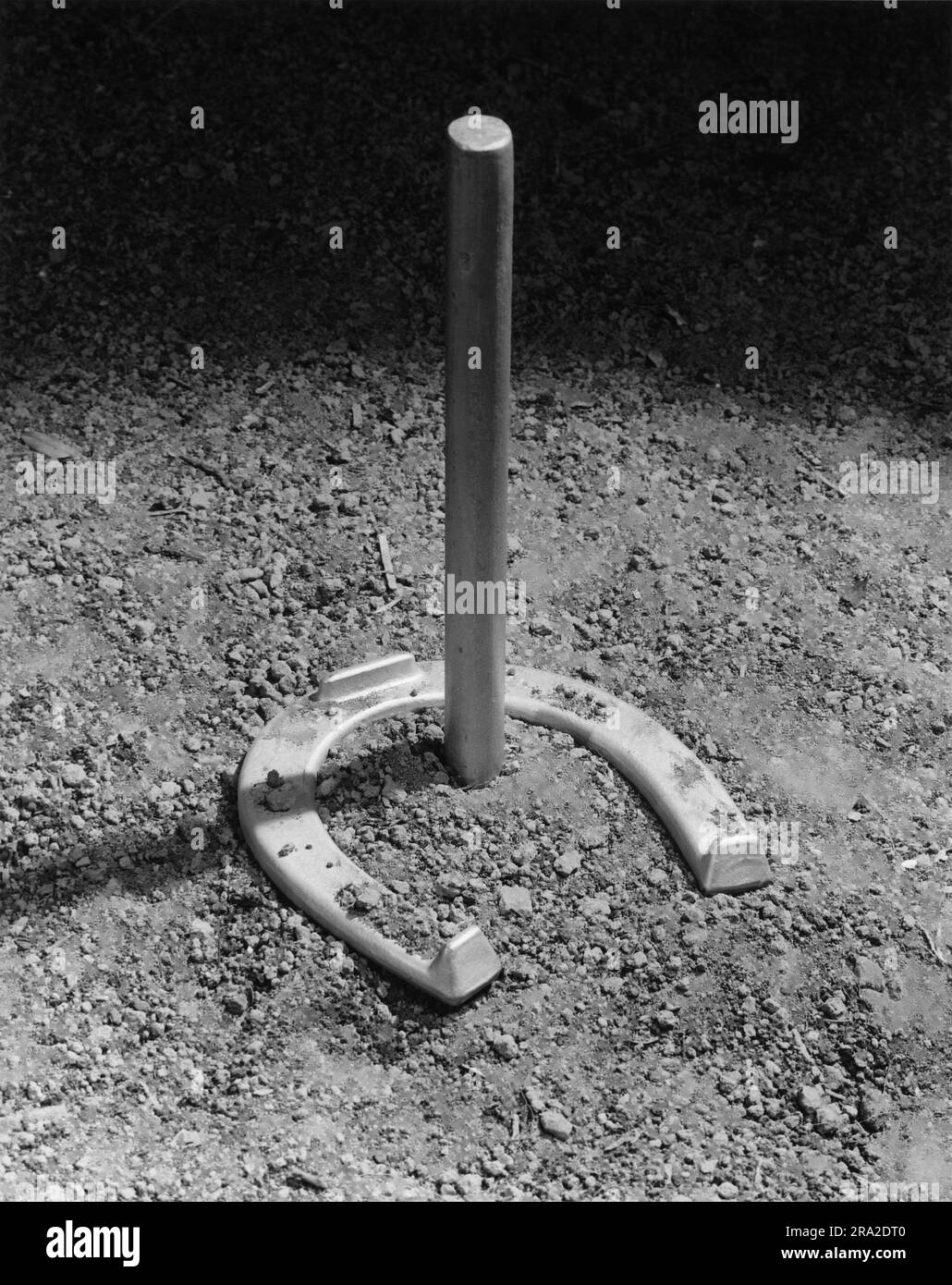 Single horseshoe shown as a ringer around the post Stock Photo - Alamy