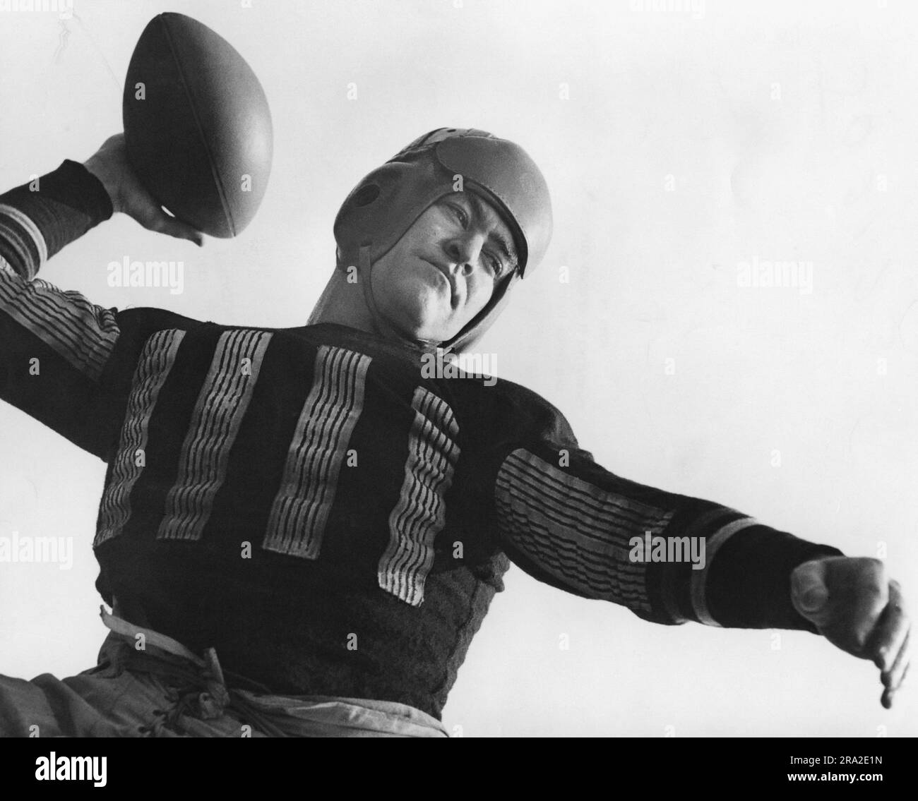 Close-up of an old-time football quarterback with old-style leather ...