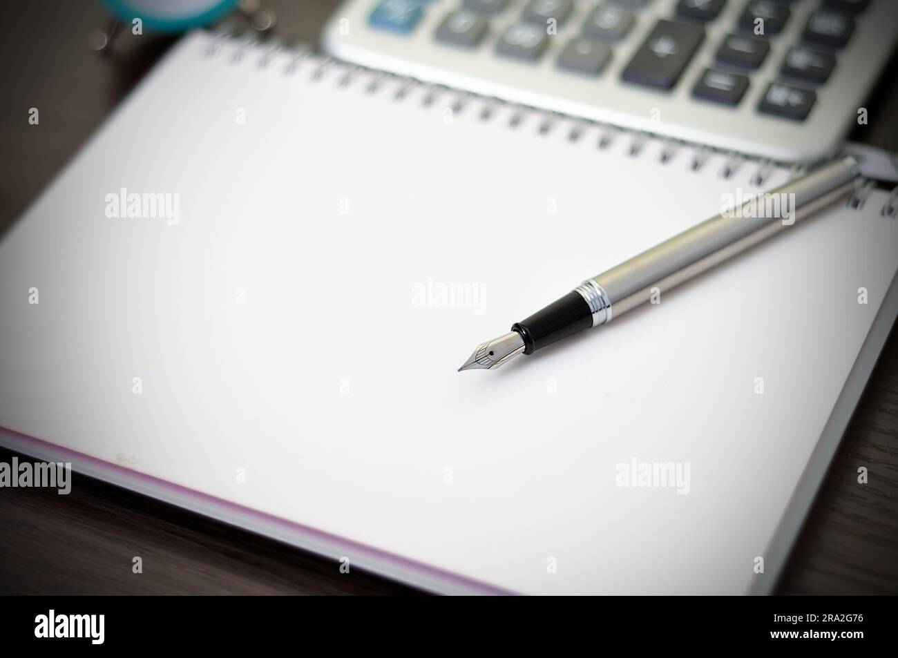 Office calculator book note pad pen hi-res stock photography and images ...