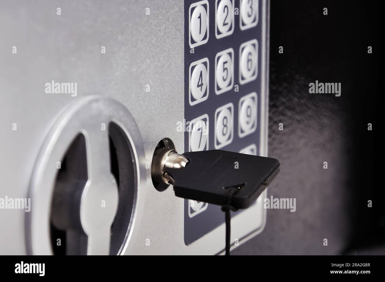 key is inserted in lock of safe Stock Photo - Alamy