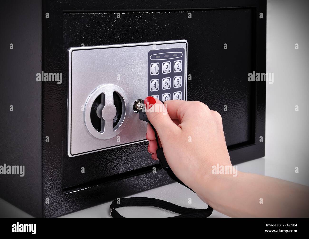 women hand opens a key safe Stock Photo - Alamy